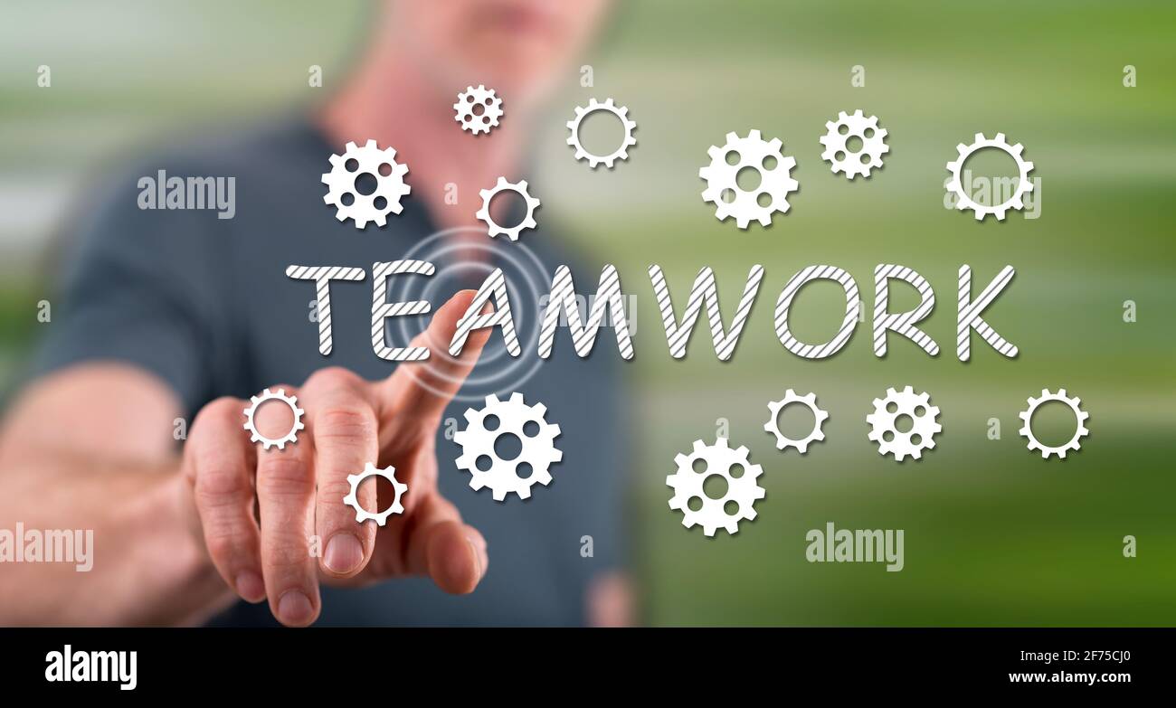Man touching a teamwork concept on a touch screen with his finger Stock ...