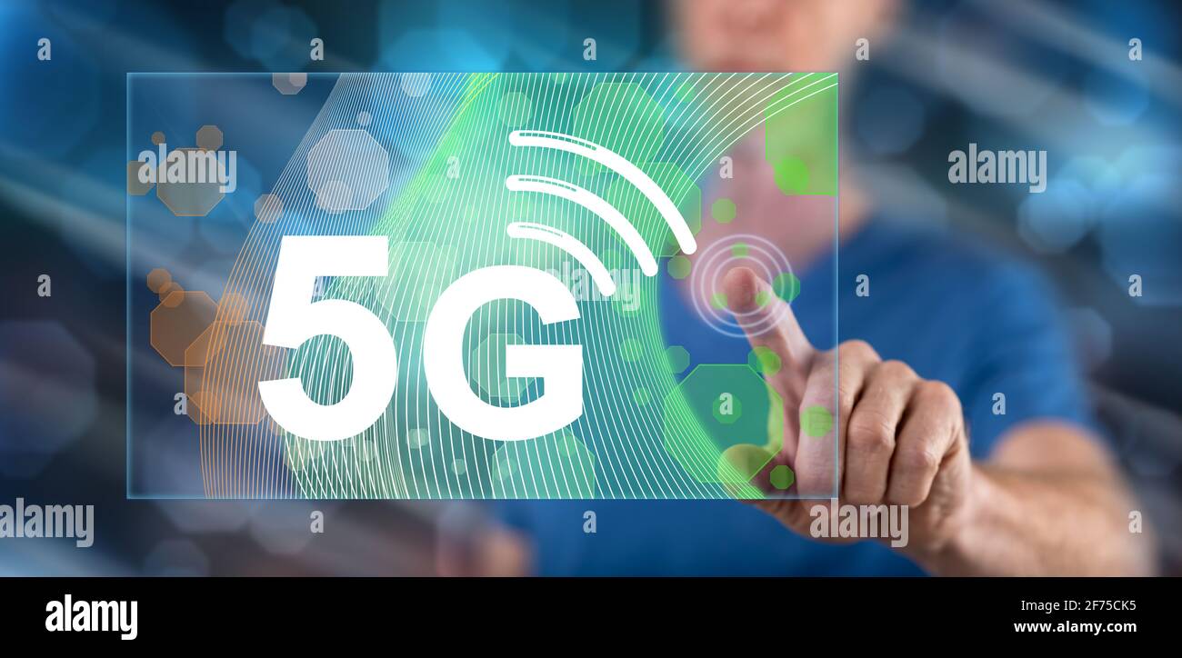 Man touching a 5g concept on a touch screen with his finger Stock Photo ...