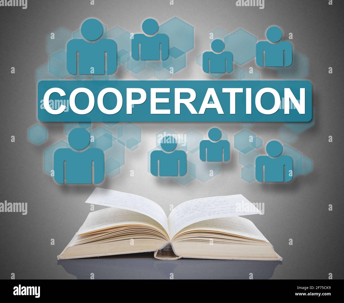 Cooperation concept above an open book Stock Photo - Alamy