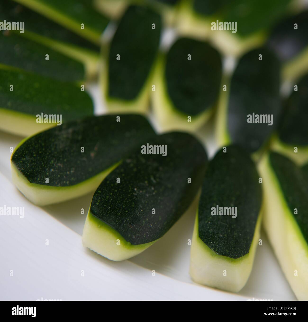 Preparing fresh courgette, zucchini on wood table Stock Photo - Alamy