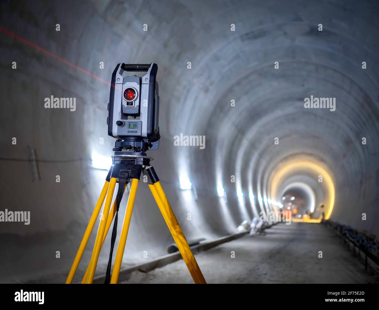 Theodolite at underground railway tunnel construction work ...