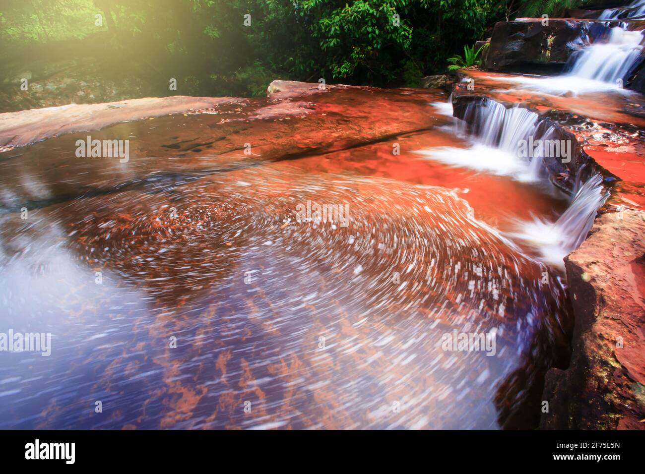 Layers of rock with falling water hi-res stock photography and images ...