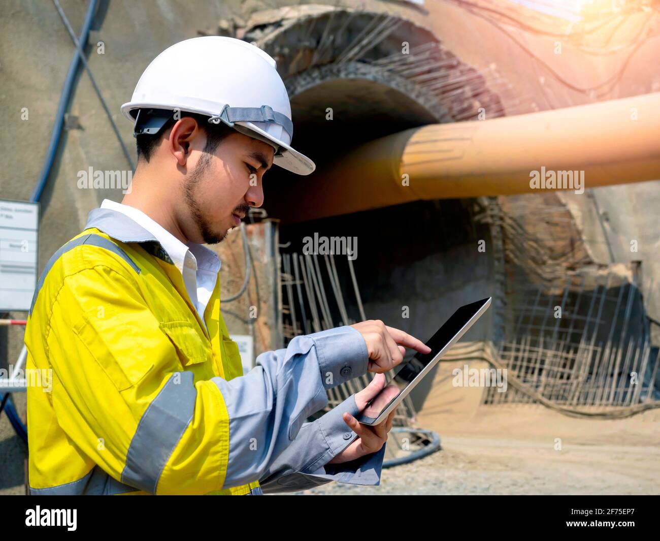 Wearing safety helmet jacket hi-res stock photography and images - Alamy