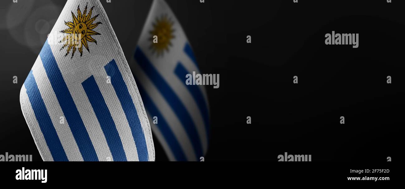 Small national flags of the Uruguay on a dark background Stock Photo ...