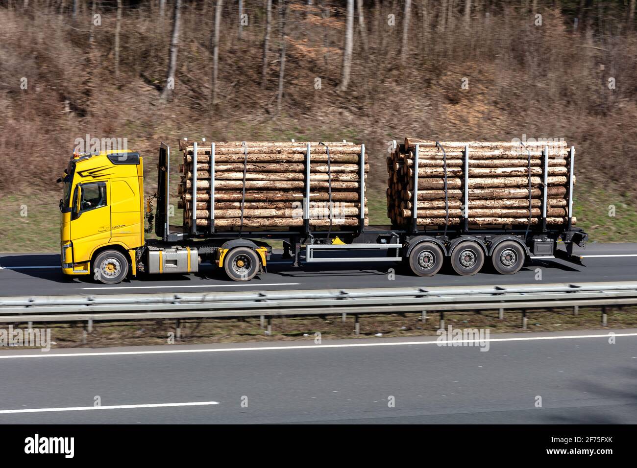 Volvo FH logging truck on motorway Stock Photo - Alamy