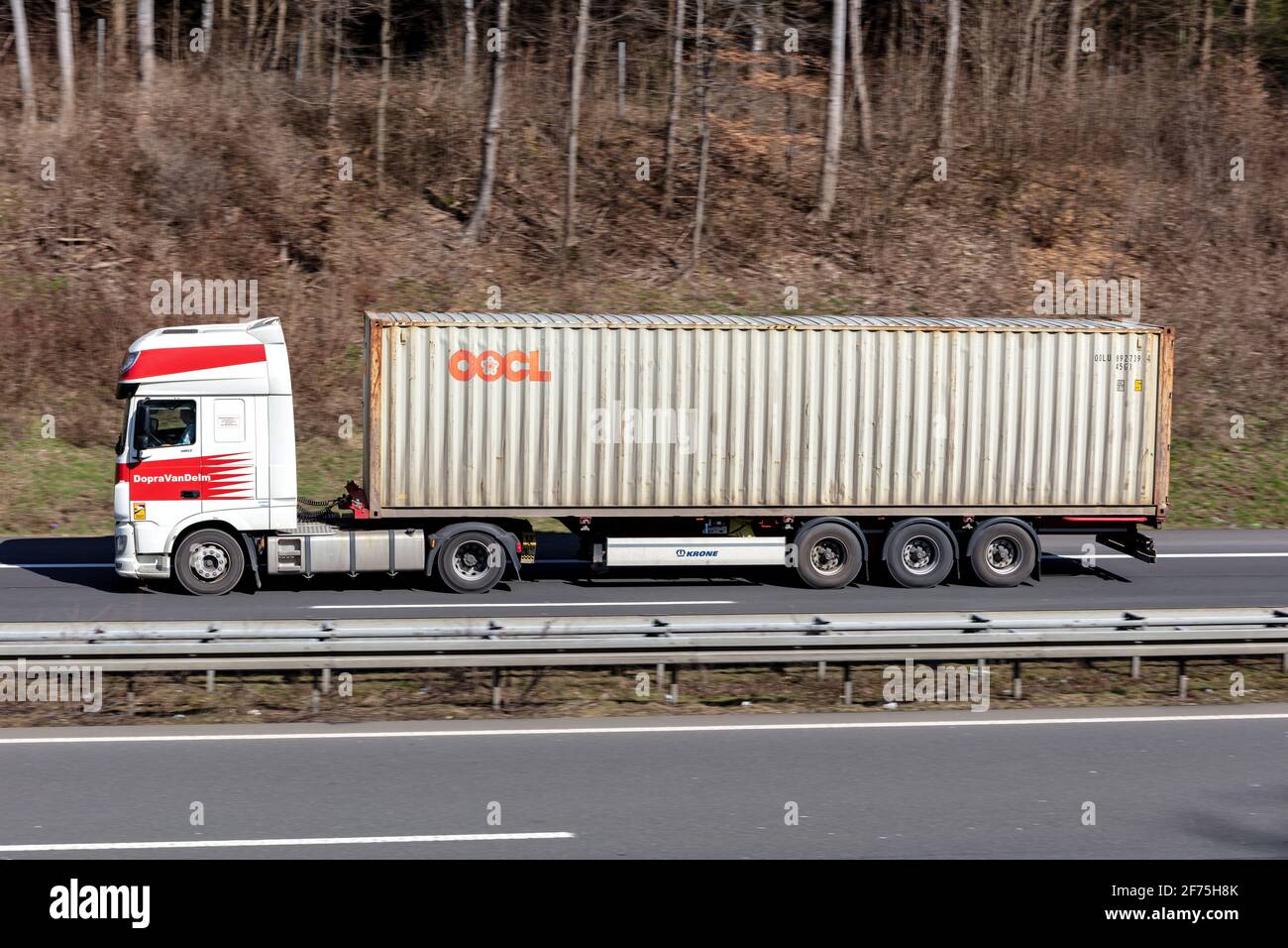 DopraVanDelm DAF XF truck with OOCL container on motorway Stock Photo ...