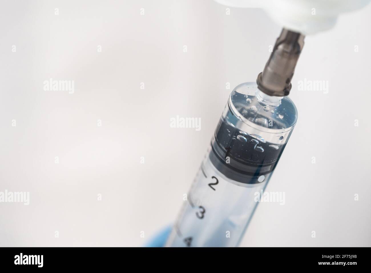 Close-up of a syringe with a dose of medicine for viruses and ...