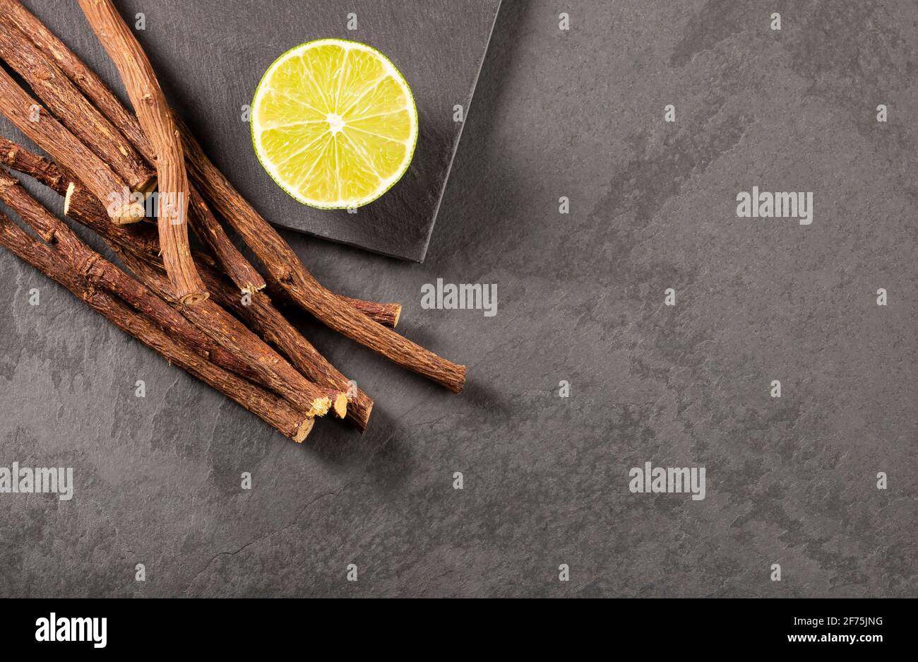 Licorice root and lemon - Glycyrrhiza glabra Stock Photo - Alamy