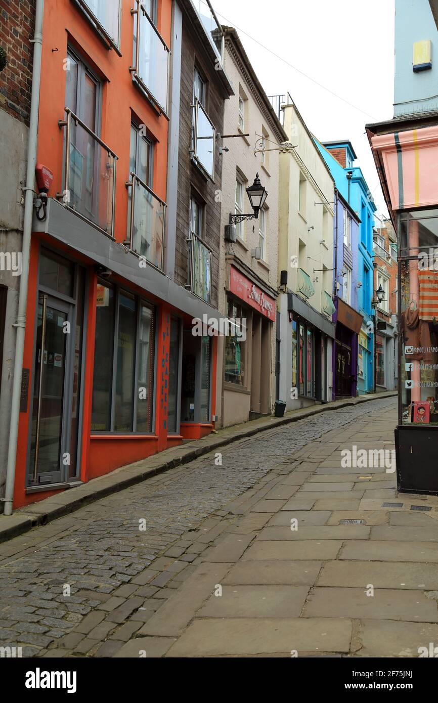 View of colouful painted buildings and narrow cobbled street in The Old ...