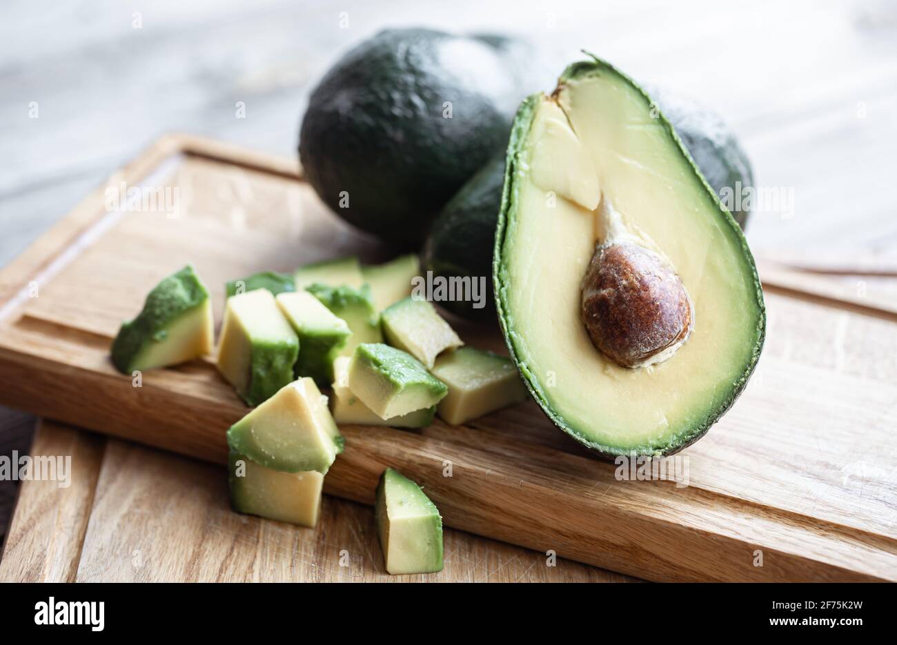 Cutaway of a fresh ripe avocado. Healthy food, diet and raw food diet ...