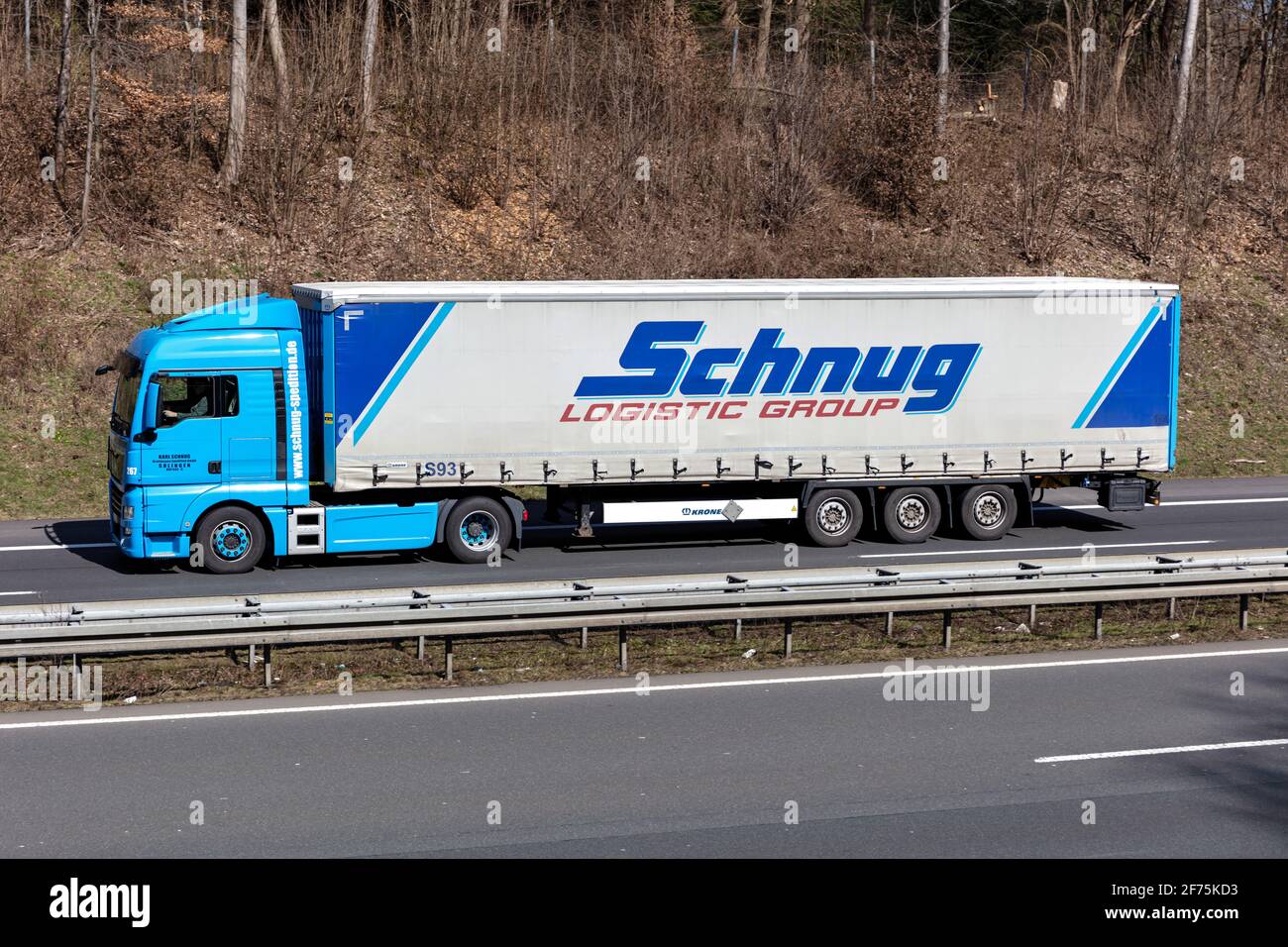 Schnug MAN truck with curtainside trailer on motorway Stock Photo - Alamy
