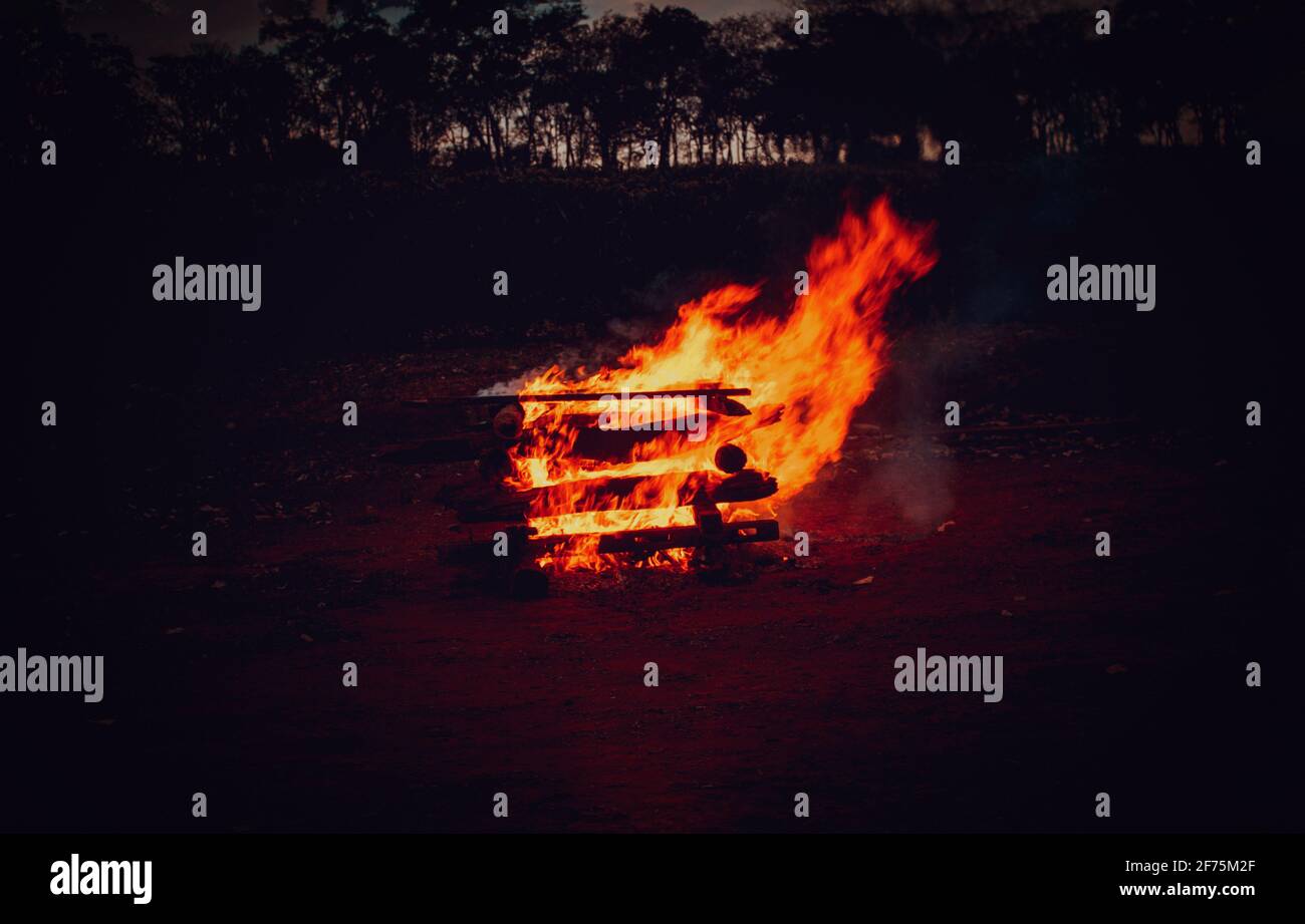 Bonfire giant in contryside. Isolated on black background. Space for ...