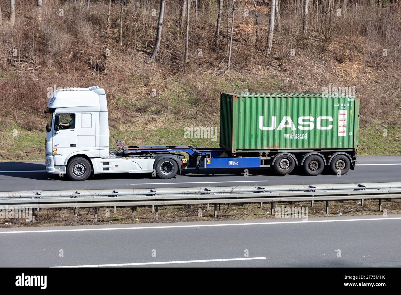 DAF XF truck with 20 ft UASC container on motorway Stock Photo - Alamy
