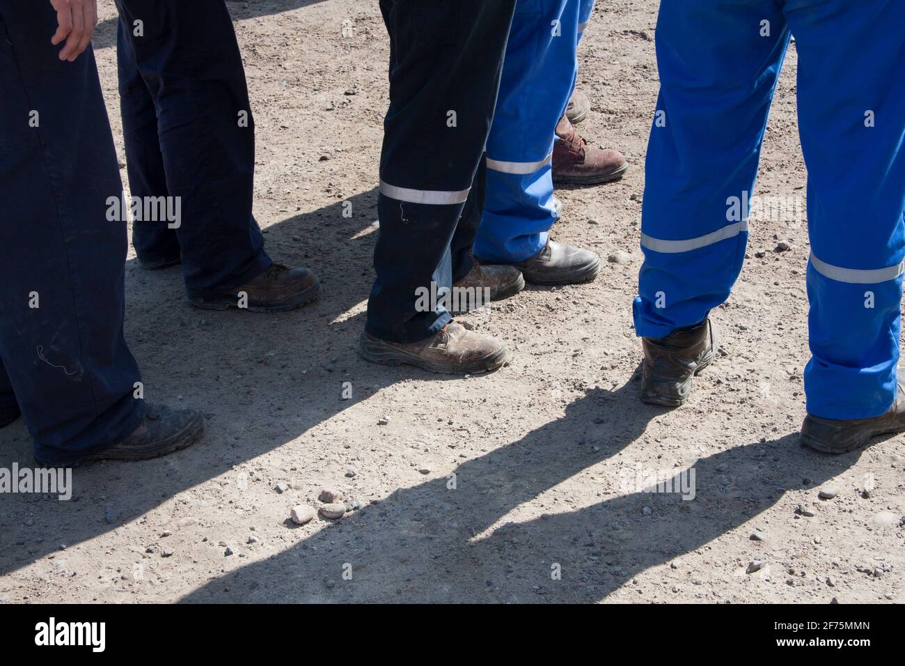 Group Of Oil and Gas Workers Wearing PPE in the Desert Stock Photo - Alamy