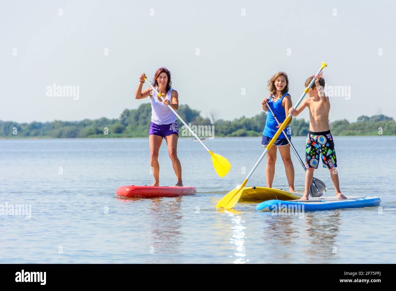 Boy girl on paddle board hi-res stock photography and images - Alamy