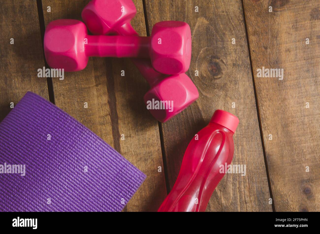 water and yoga exercise materials, on wooden floor Stock Photo - Alamy