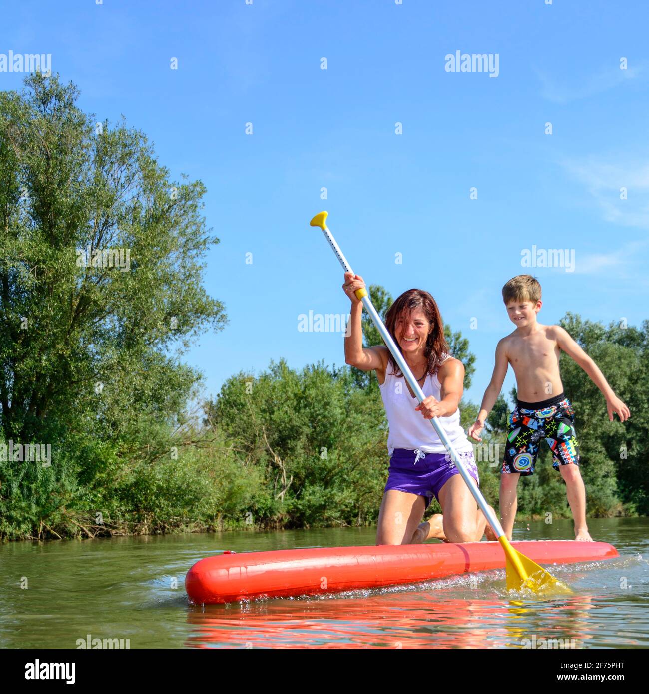 Funny times on SUP-board Stock Photo - Alamy