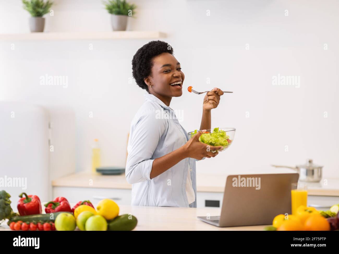 African woman eating salad hi-res stock photography and images - Alamy