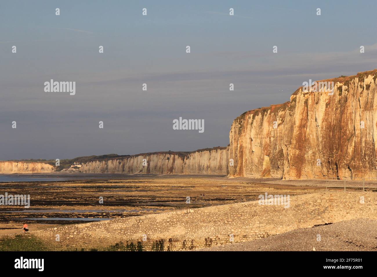 beautiful golden colored cliffs behind the beach at the french coast in ...
