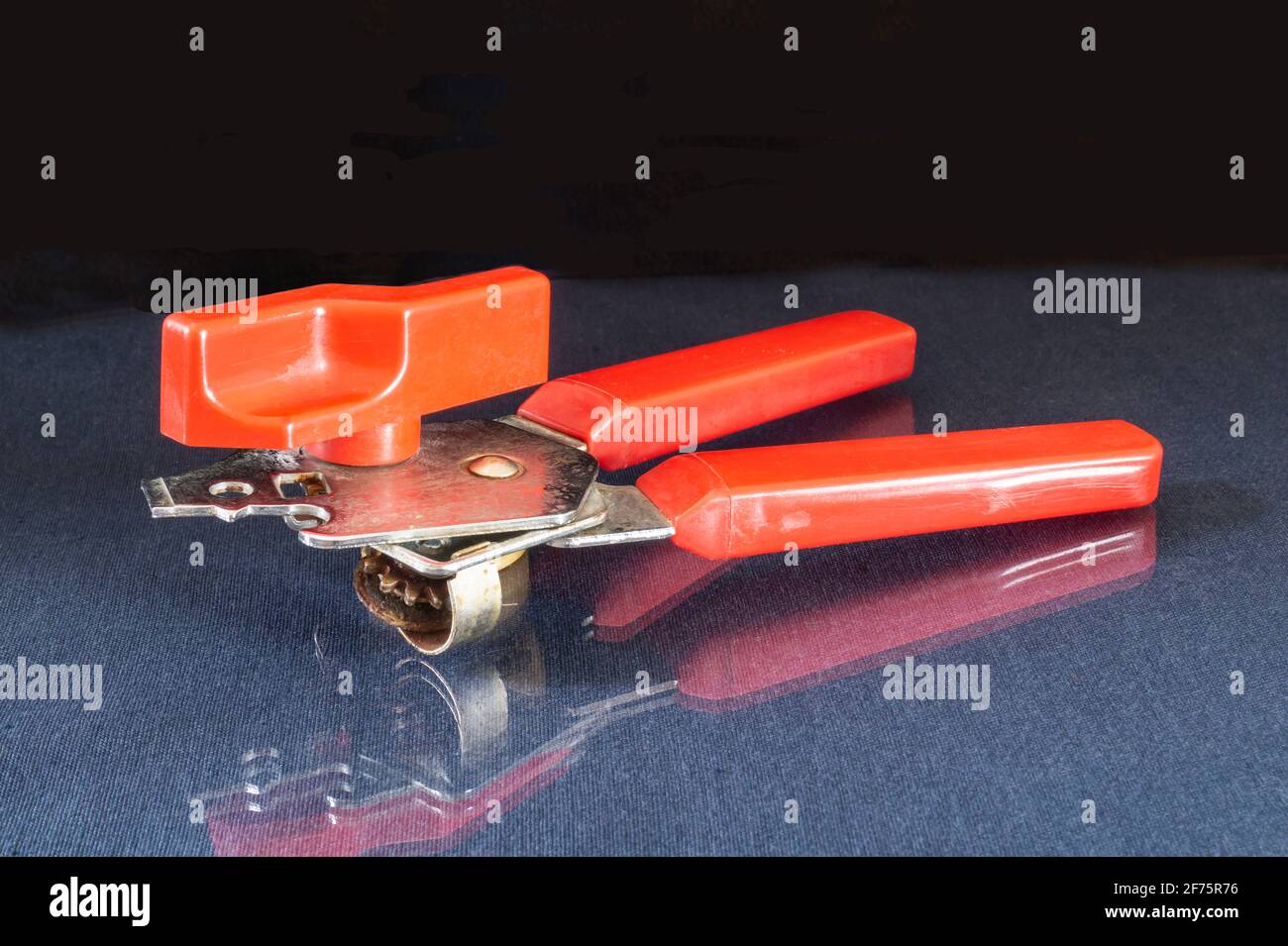 Manual mechanism with red handle on black background.rolling machine ...