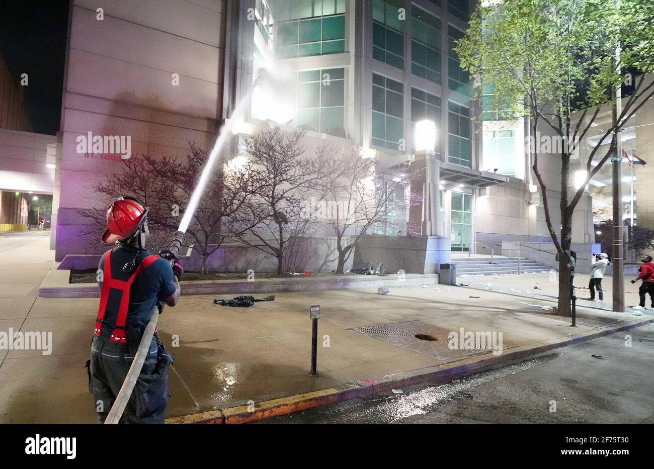 St. Louis, United States. 4th Apr, 2021. A St. Louis firefighter sprays ...