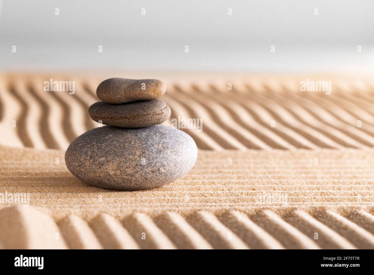 Japanese zen garden with stone in raked sand Stock Photo - Alamy