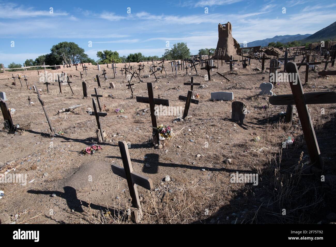 The historic Taos Pueblo cemetery in New Mexico, featuring weathered ...