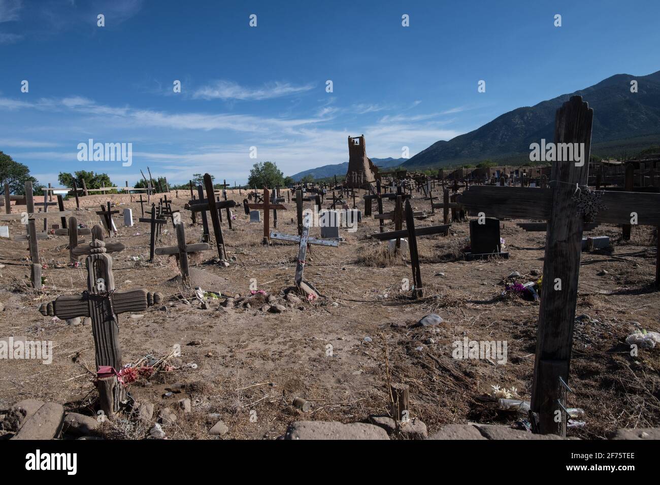 The historic Taos Pueblo cemetery in New Mexico, featuring weathered ...