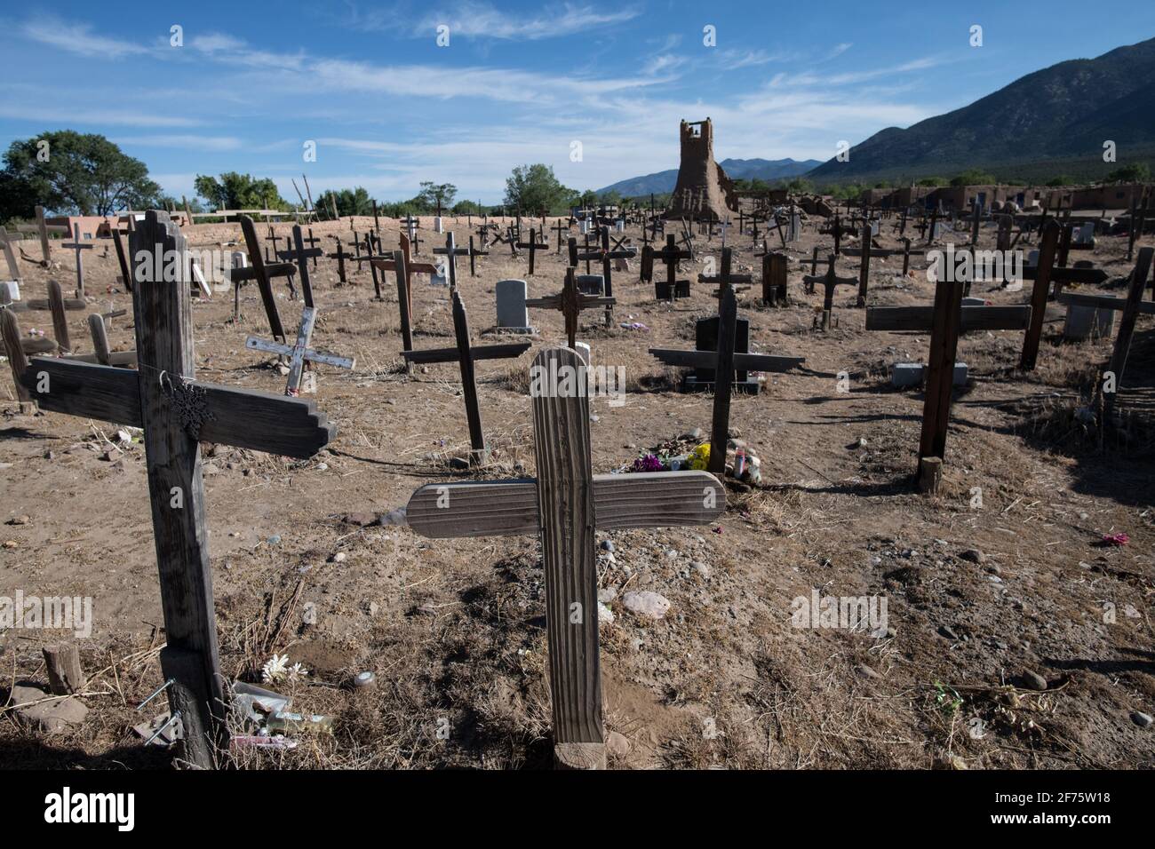 The historic Taos Pueblo cemetery in New Mexico, featuring weathered ...