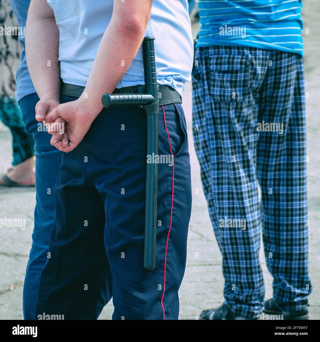 Hand police baton on belt hi-res stock photography and images - Alamy