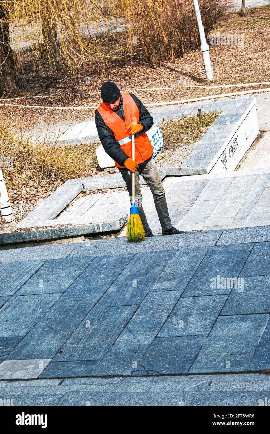 Cleaner sweeping uniform urban hi-res stock photography and images - Alamy