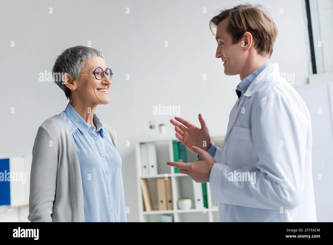 Talking doctor patient emotion hi-res stock photography and images - Alamy