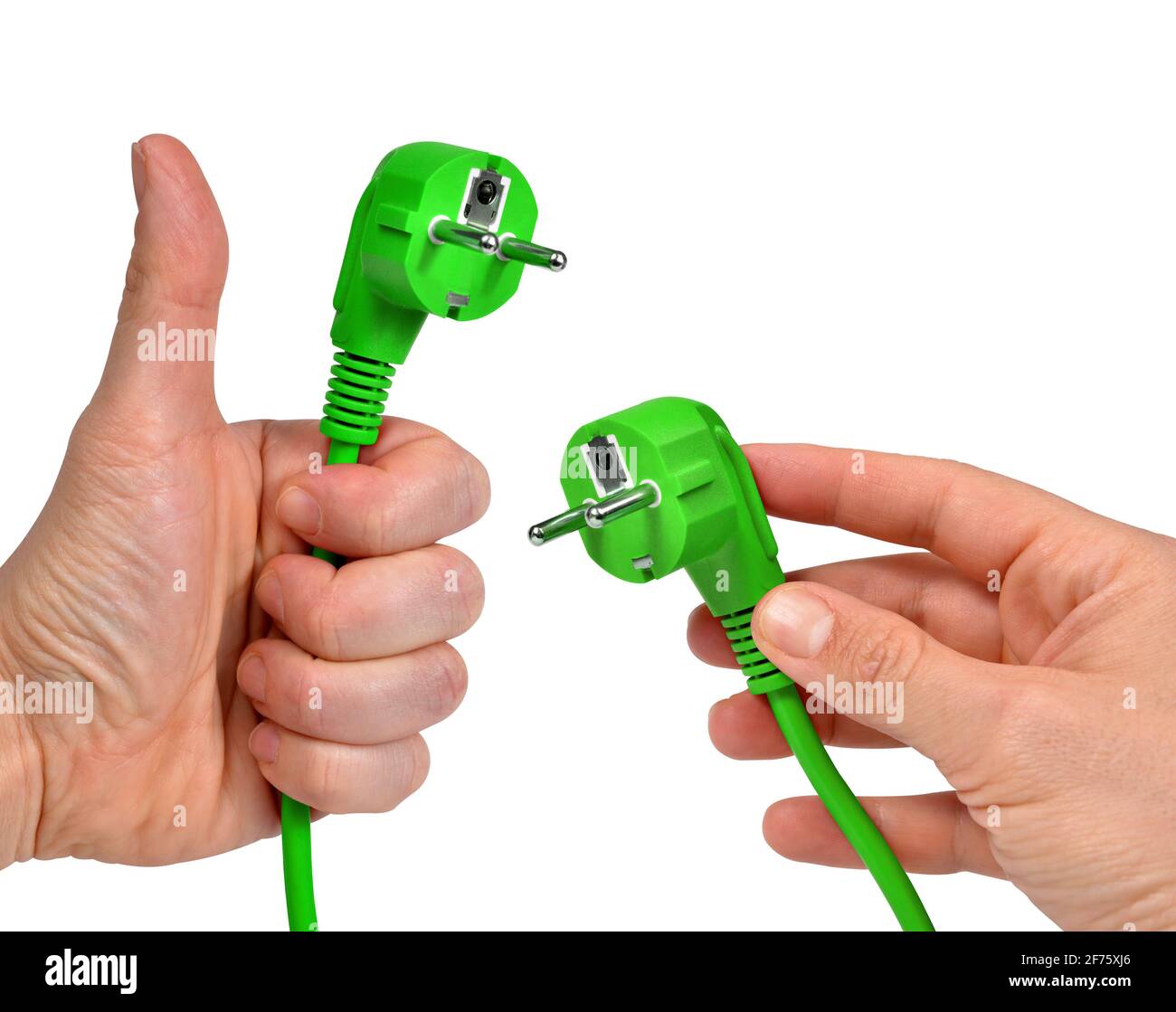 Hand holding green electric plug isolated on a white background Stock ...