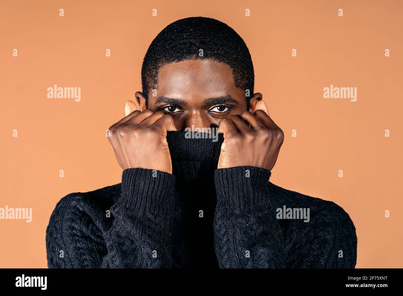 Portrait smiling man covering eyes his hands hi-res stock photography ...