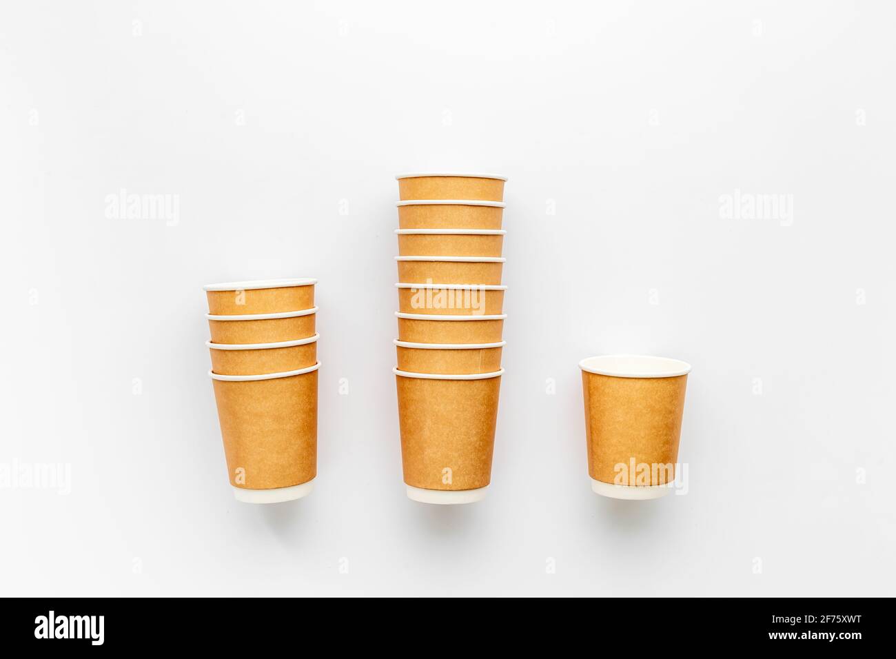 Layout of coffee paper cups. Overhead view Stock Photo - Alamy