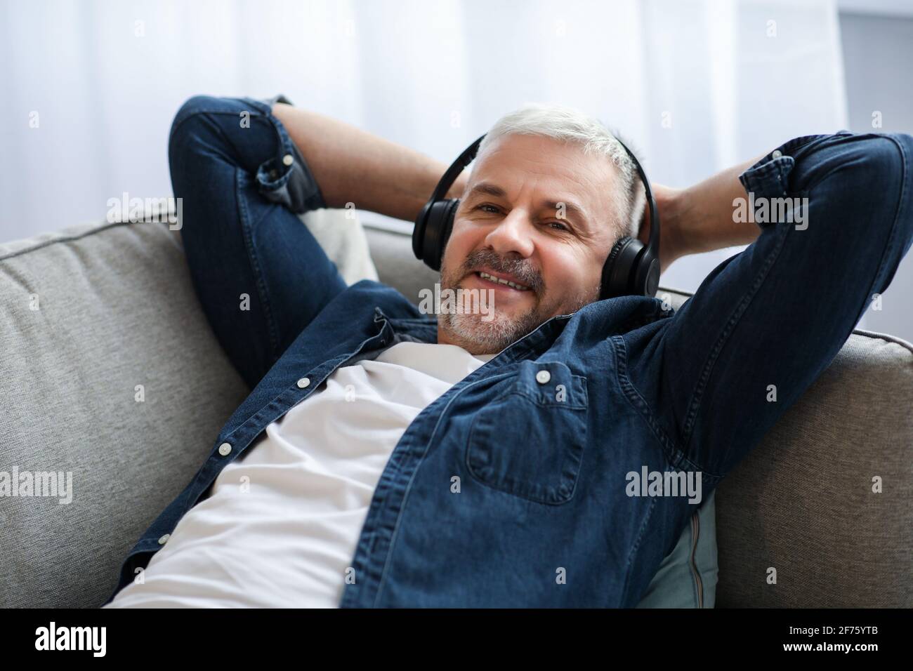 Man reclining hi-res stock photography and images - Alamy