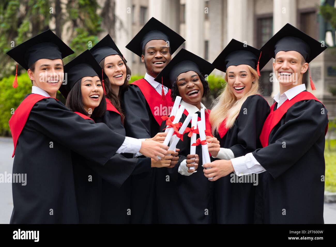 Diverse International Students With Diplomas Celebrating Graduation ...