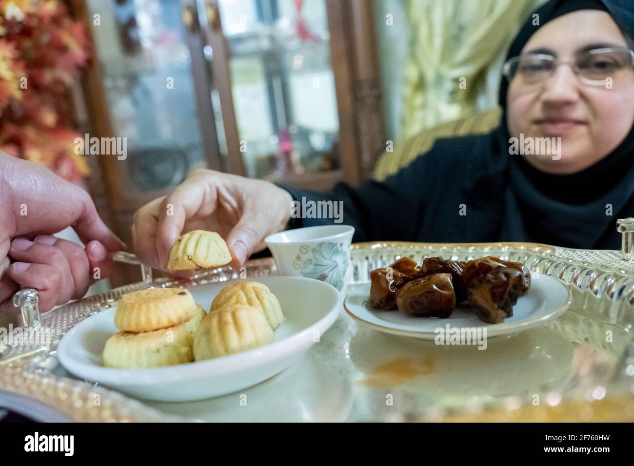 Arabic man serving coffee Stock Photo - Alamy