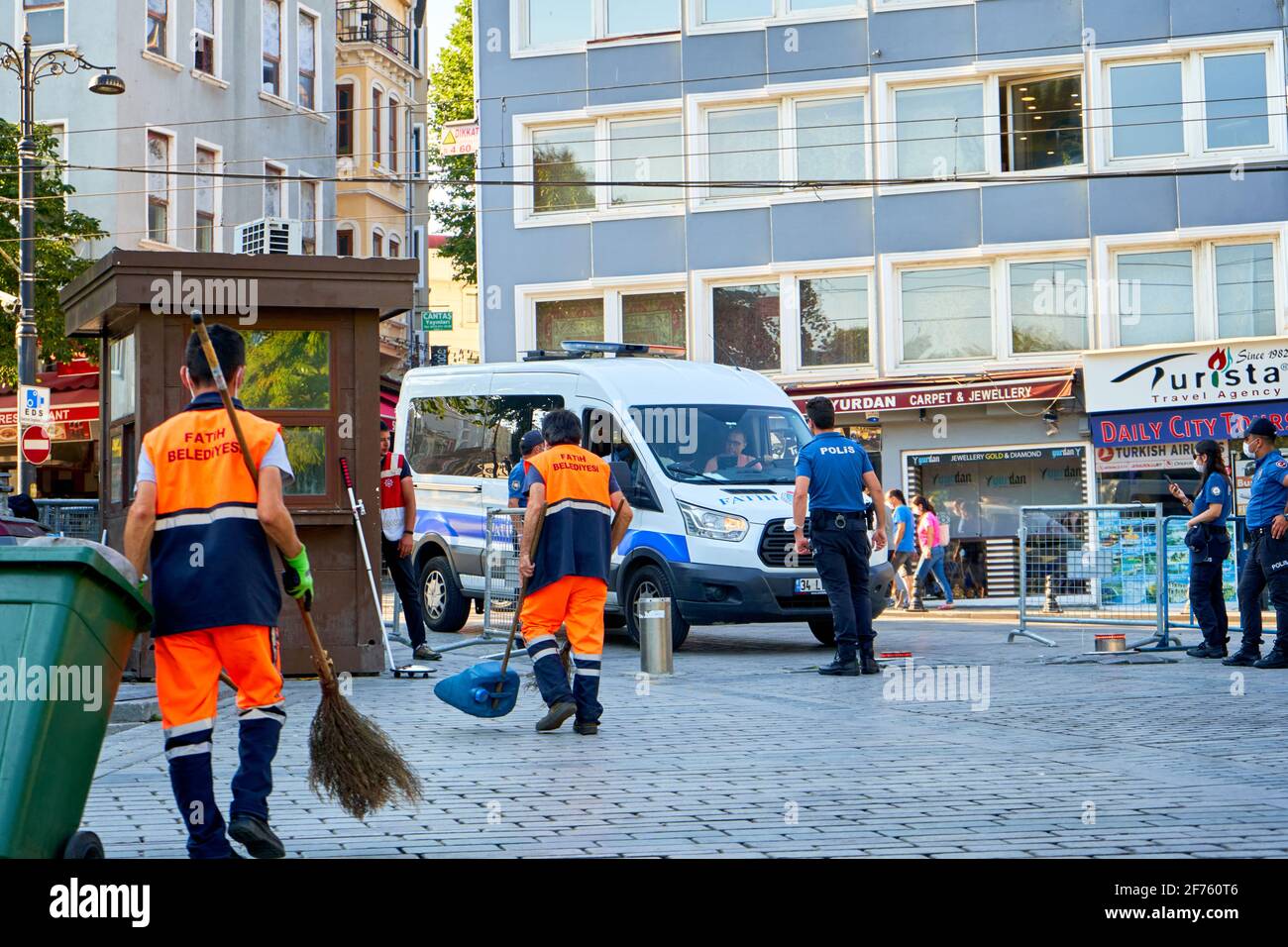 Walking tour of istanbul. Wipers sweeping the street. A police van ...
