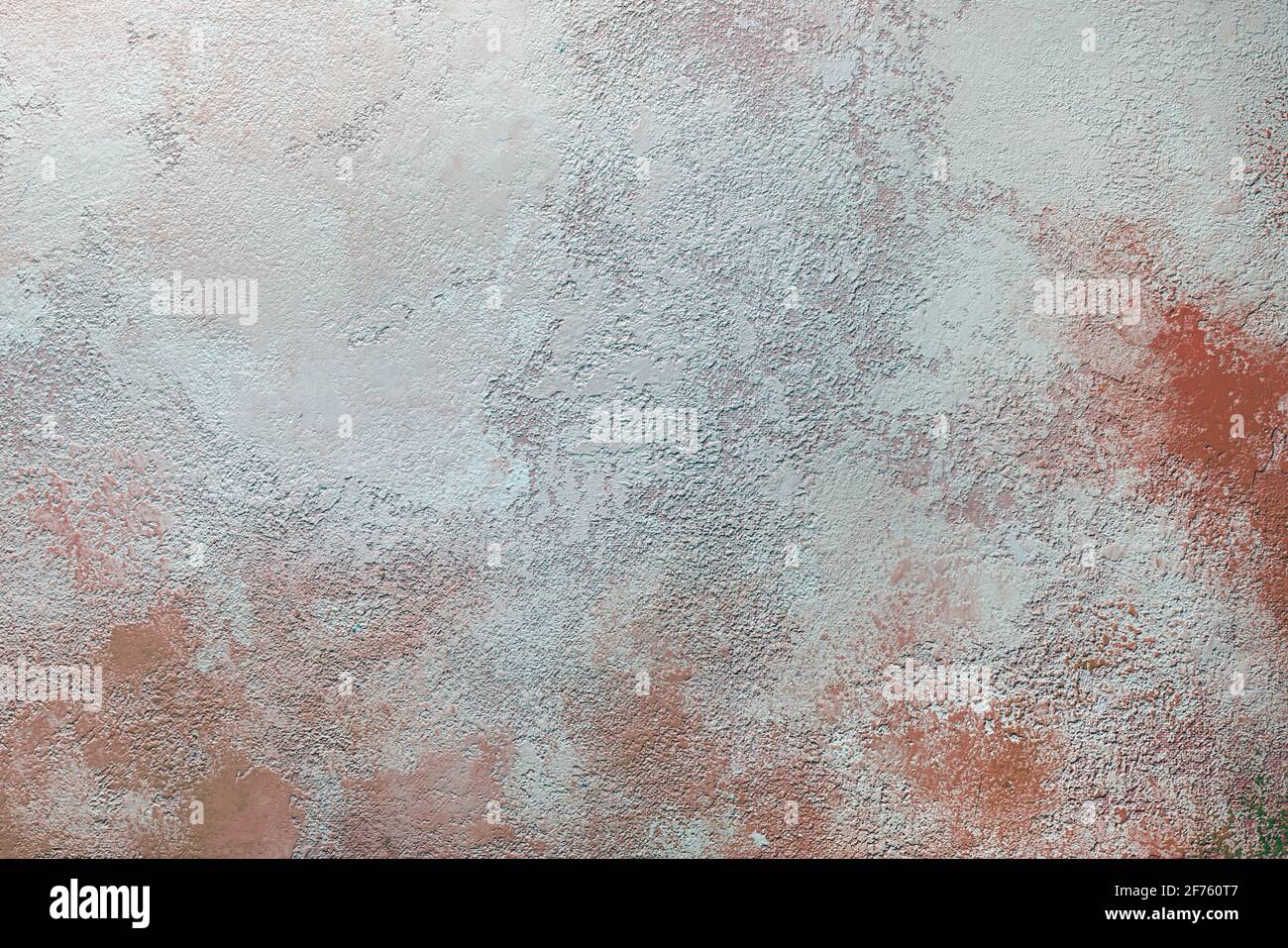 the background is a dirty wall. Stains and red streaks on the old ...