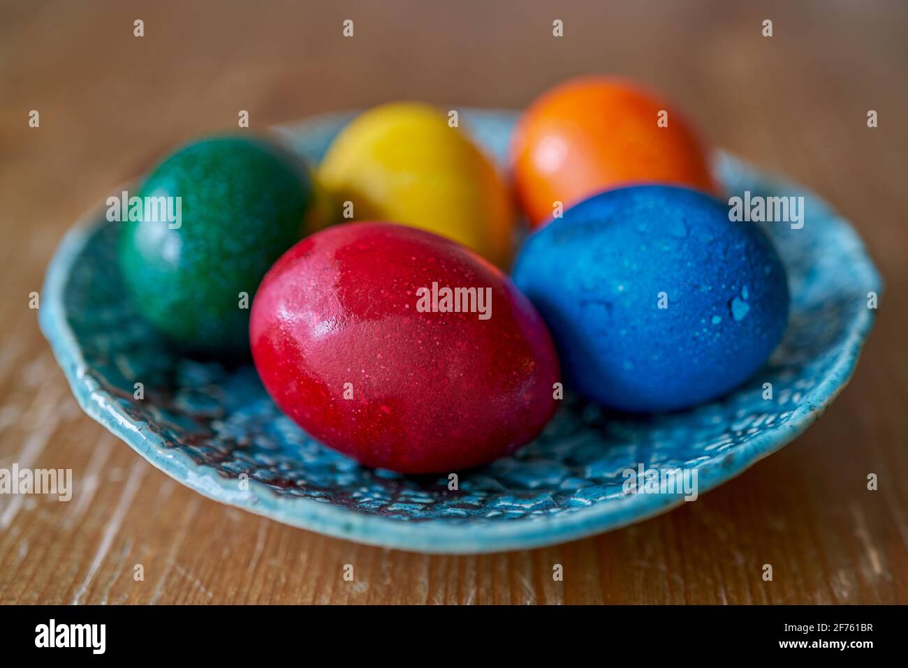 Multicolor colorful five easter eggs on the plate Stock Photo - Alamy