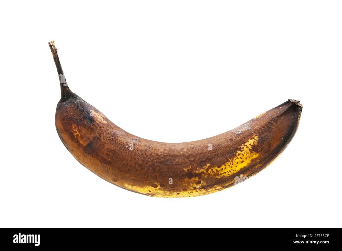 overripe spotted banana in yellow rotten peel vegetarian food isolated ...