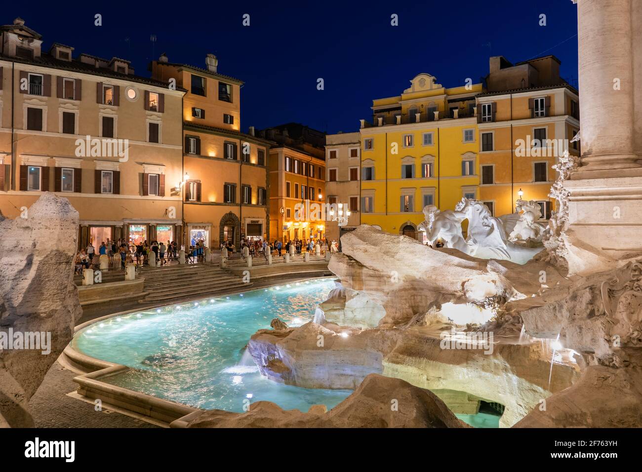Piazza di Trevi square and Trevi Fountain at night in city of Rome ...