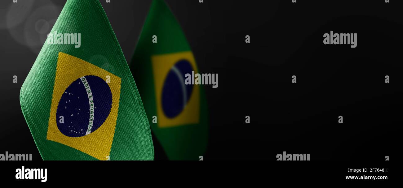 Small national flags of the Brazil on a dark background Stock Photo - Alamy