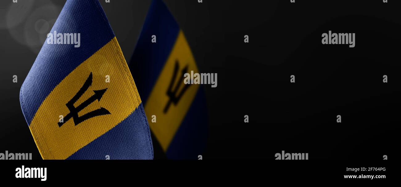 Small national flags of the Barbados on a dark background Stock Photo ...