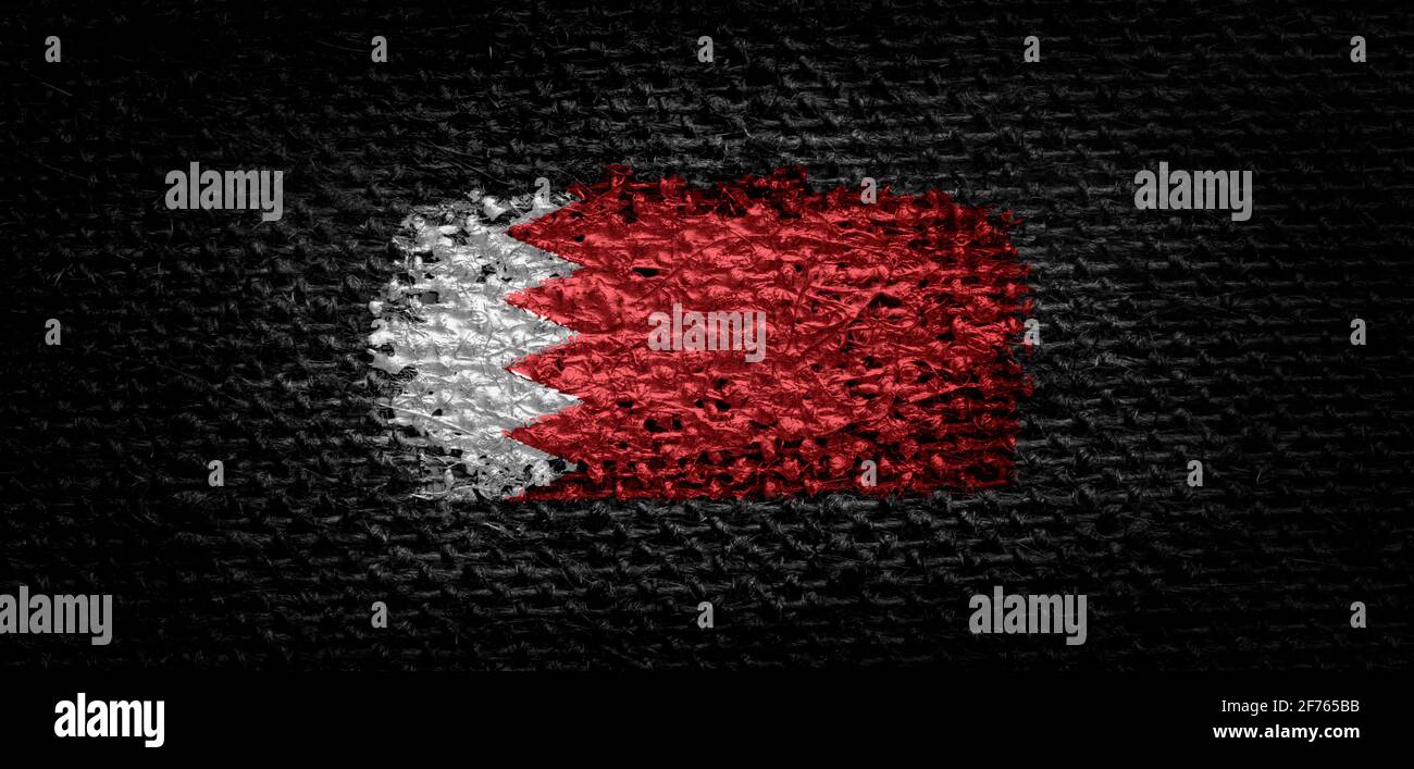National flag of the Bahrain on dark fabric Stock Photo - Alamy