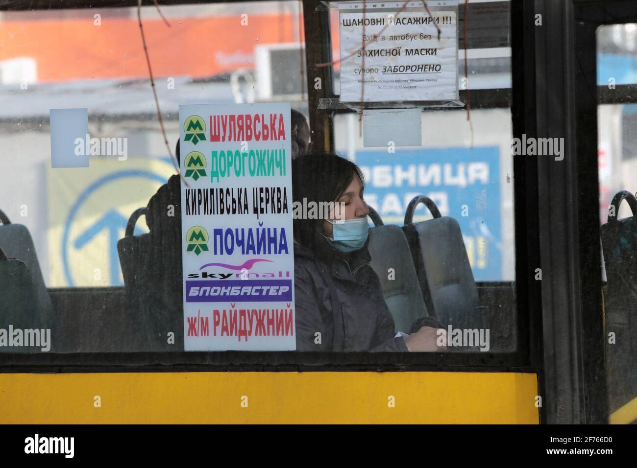 KYIV, UKRAINE - APRIL 05, 2021 - A woman in a medical mask is seen on a ...