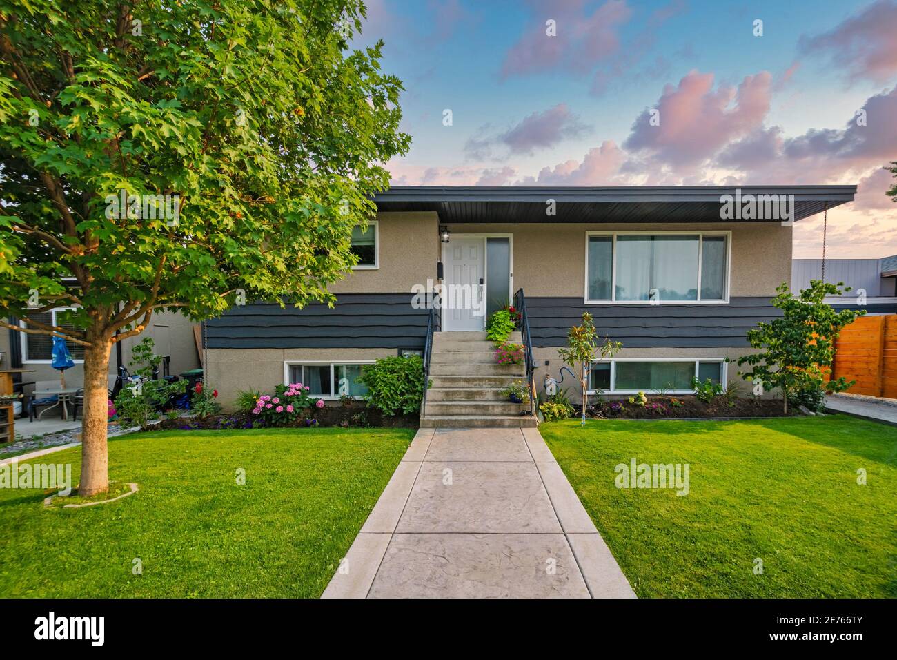 Average family house with concrete pathway over front yard Stock Photo ...