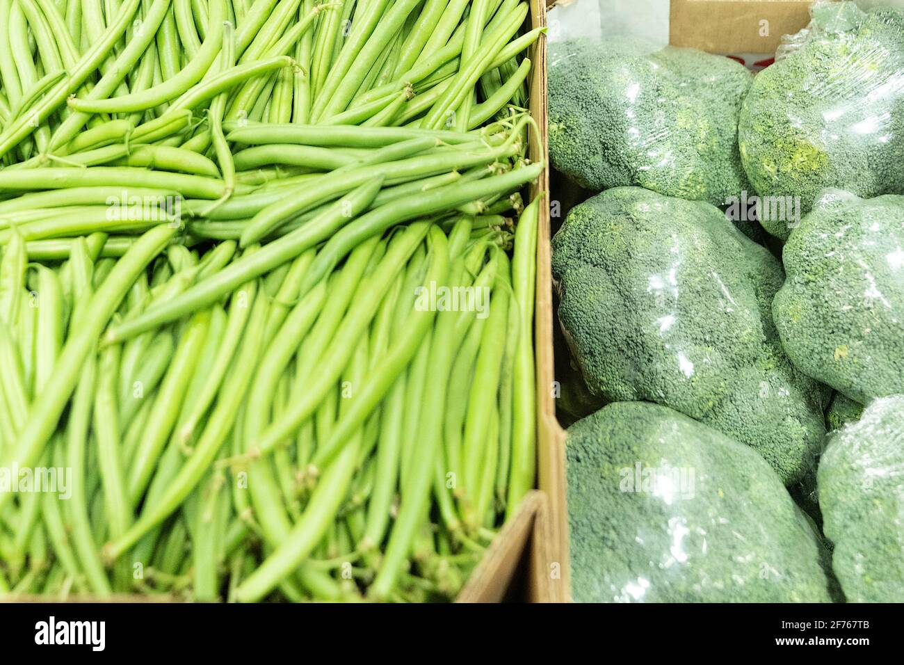 A box with fresh green vegetables beans and broccoli Stock Photo - Alamy