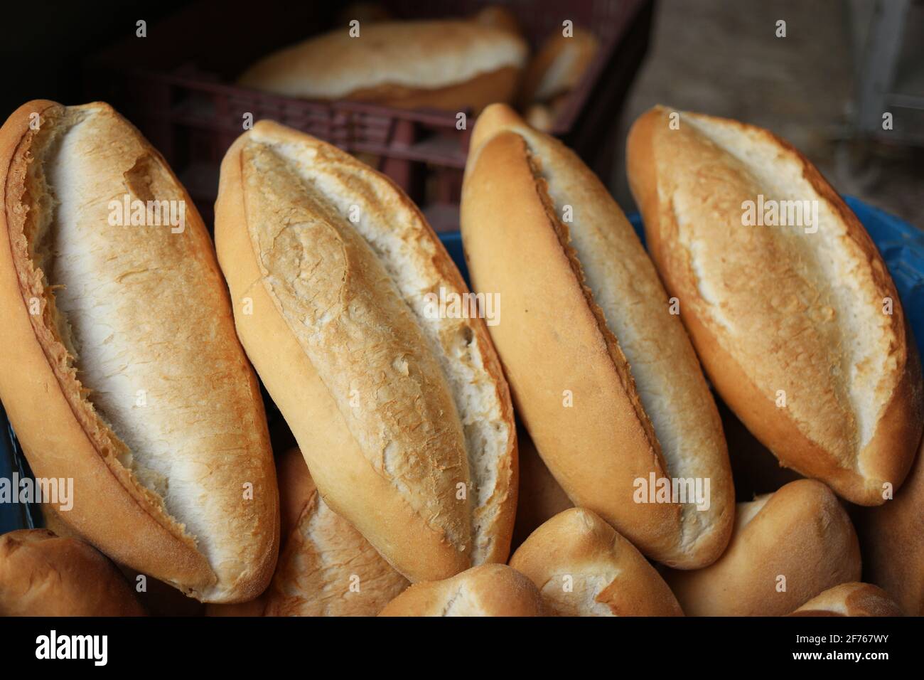 Traditional crusty French bread baguette in basket at bakery Stock ...